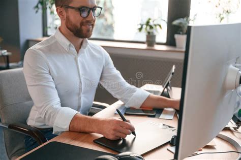 Man In Formal Clothes Is Working In The Modern Office Using Computer