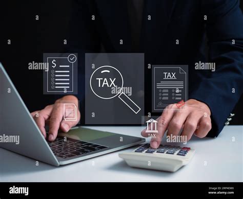 Businessman Using A Computer To Complete Individual Income Tax Return Form Online For Tax
