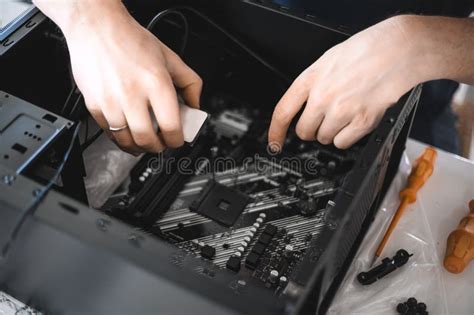 Handsome Nerd Man Is Servicing Computer Motherboard And Cooler Stock Photo Image Of