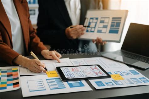 Ux Developer And Ui Designer Brainstorming About Mobile App Interface