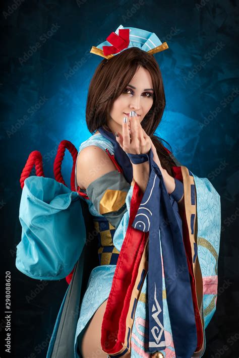 Beautiful Smiling Leggy Busty Cosplay Girl Wearing A Stylized Japanese