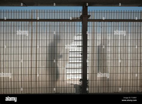 Palestinians Move Through Cage Like Passage At The Kalandia Or Qalandiya Crossing Between