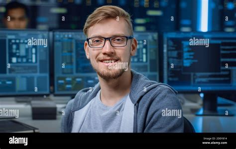 Portrait Of A Smart And Handsome It Specialist Wearing Glasses Smiles