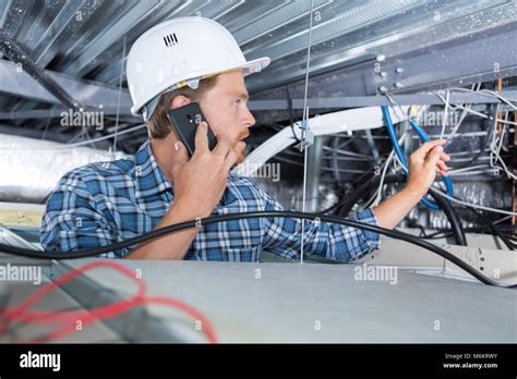 Fixing Cables On The Ceiling Stock Photo Alamy