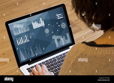 Business Concept Woman Analyzing Statistics On A Laptop Screen Screen Graphics Are Made Up