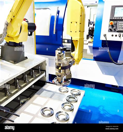 Robotic Arm And Cnc Lathe Machine Stock Photo Alamy