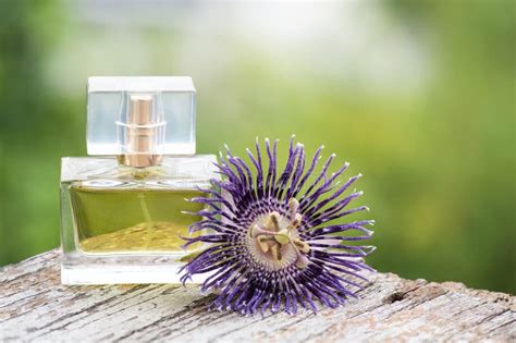 Perfume And Blue Passion Flower On Nature Background Stock Image