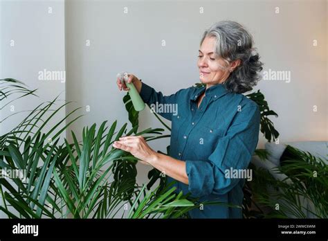 Mature Woman Spraying Water Squirt Hi Res Stock Photography And Images Alamy