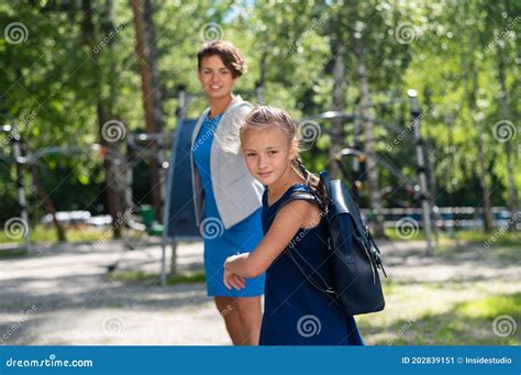 The Naughty Daughter Pulls Her Mother By The Hand Stock Image Image