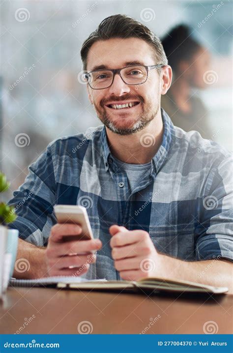 I Prefer Staying Hands On Portrait Of A Mature Businessman Texting On A Cellphone In An Office