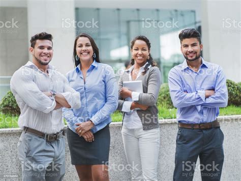 Portrait Of Happy Business Team Outdoors Looking At The Camera Stock