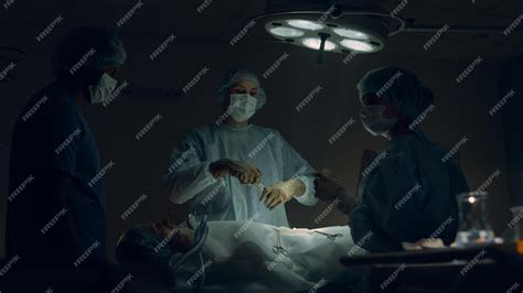 Premium Photo Medical Team Performing Surgery In Hospital Room
