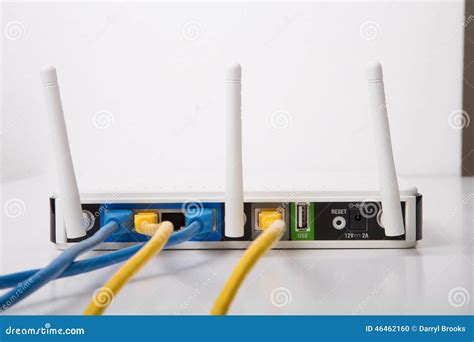White Wireless Router With Blue And Yellow Cables Stock Photo Image Of Rj Bandwidth