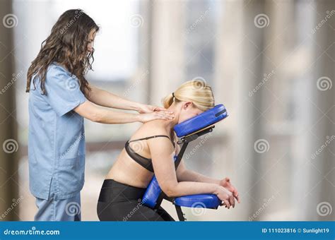 Chiropractor Physiotherapist Giving A Back Massage To A Woman P Stock