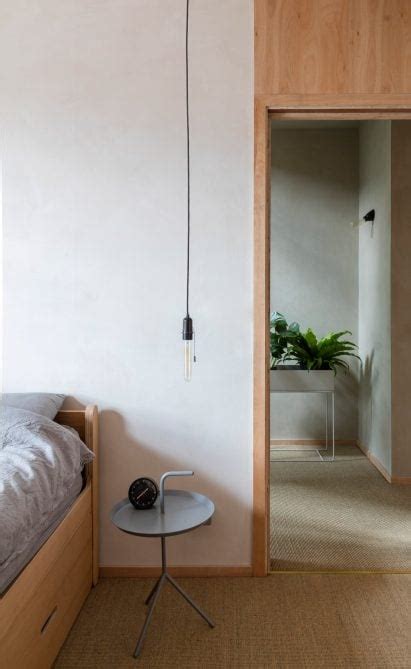 Smoked Oak And Rustic Clay Line Walls Of Japanese Styled Apartment
