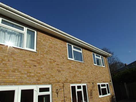 Installation Of White Upvc Fascias Soffits And Square Pvc Guttering To A 1970s House In Sutton