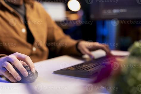 Man Doing Software Quality Assurance Using Keyboard And Mouse Reading