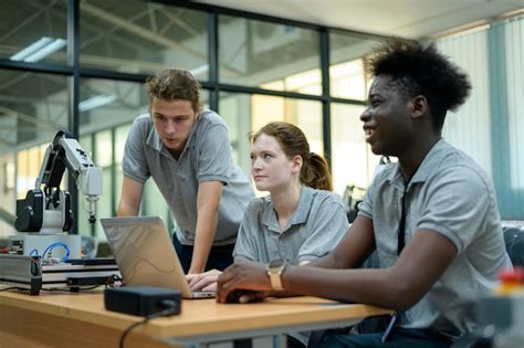 Premium Photo Trainee Robotics Engineer Learning With Programming And Manipulating Robot Hand