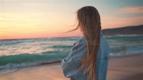 Happy Blond Woman Enjoying Sunset View Over Sea At Beach Stock Video
