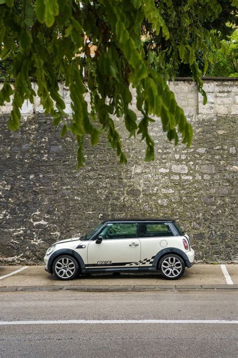 White Mini Cooper Parked Next To An Old Stone Wall In Zadar Croatia