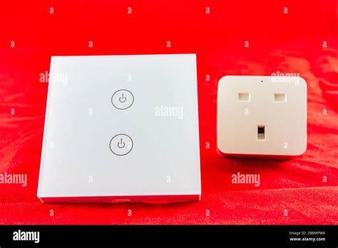 Smart Wi Fi Switch With Support For Control Via Mobile Phone Application SHot On Red Background