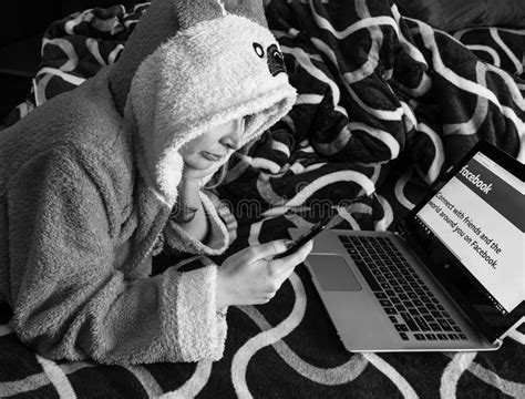 Woman Using A Laptop In Her Bed At Home Girl Logging In To Facebook Searching For News Social