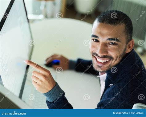 This Is My Best Work Ever Portrait Of A Smiling Young Man Sitting At A