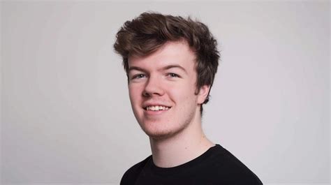 Premium Photo Handsome Smiling Software Developer Headshot