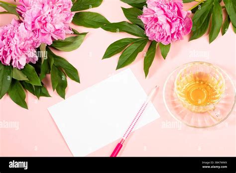 Minimalistic Greeting Card With Pen And Tea Set Against Vibrant