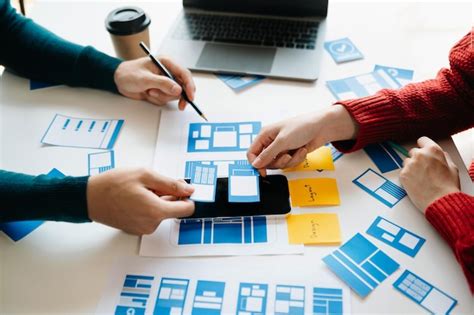 premium photo close up view of ui developer team brainstorming on