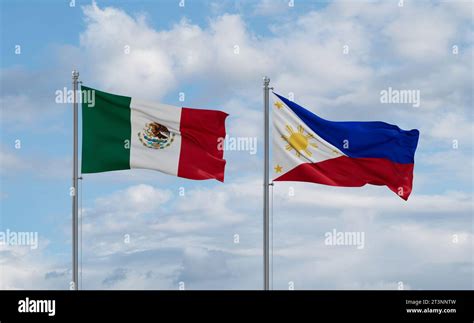 Philippines And Mexico Flags Waving Together In The Wind On Blue Cloudy