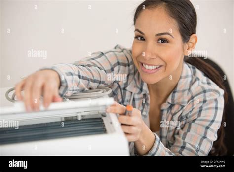 A Woman Is Fixing A Printer Stock Photo Alamy