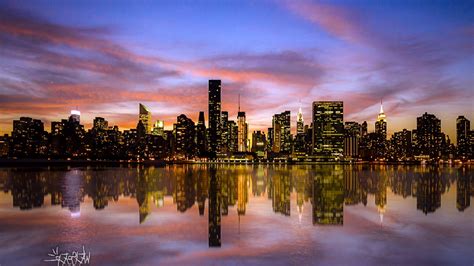 Download Caption Stunning Skyline View Of Manhattan At Sunset
