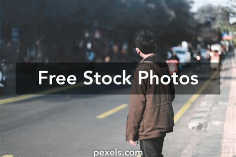 Man Looking Left And Right Before Crossing The Road Photos Download