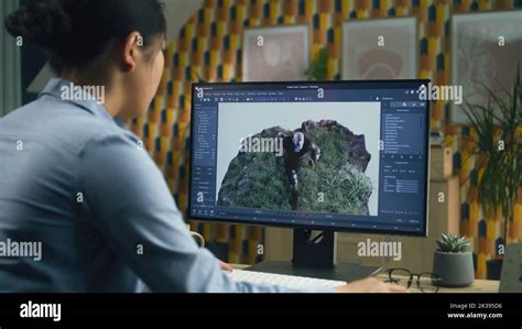 asian female 3d designer making animation for video game character