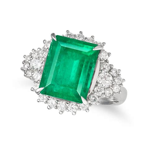 A Fine 548 Carat Colombian Emerald And Diamond Cluster Ring In