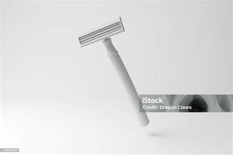 흑백과 미니멀리즘으로 공중에 떠 있는 흰색 트리플 블레이드 일회용 면도기 남성의 몸단장과 적절한 위생 습관의 개념에 대한 그림 면도날에 대한 스톡 사진 및 기타 이미지