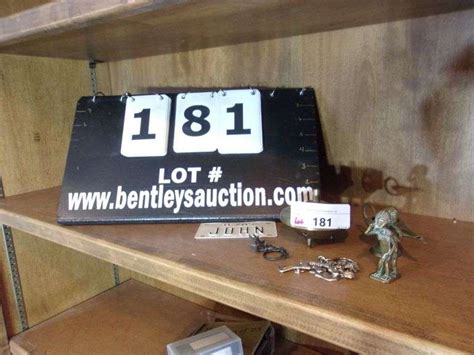 Assorted Items Sex Keychain And Figurine Lamp License Plate Bentley And Associates Llc