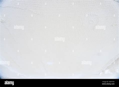 Builder Installing Rigid Styrofoam Insulation Board For Energy Saving Close Up Rigid Extruded