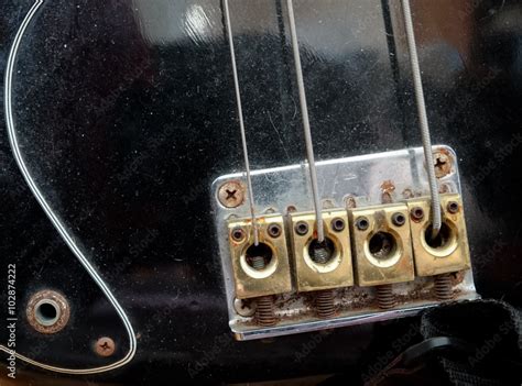 Classic Bass Guitar With A Broken String Showing The Details Of Stock