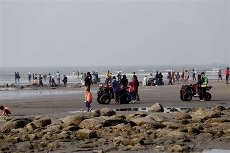 Tourists Flock To See Natural Coral Rocks At Inani Beach