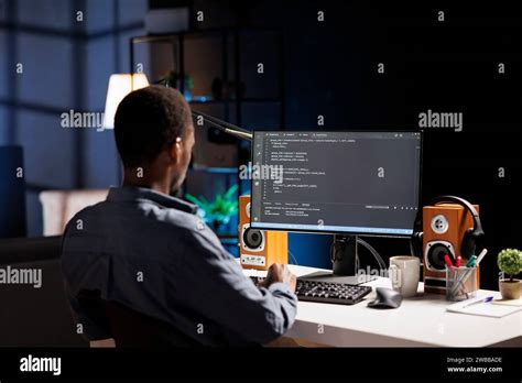 Male Developer Entering Binary Data On Terminal Panel While