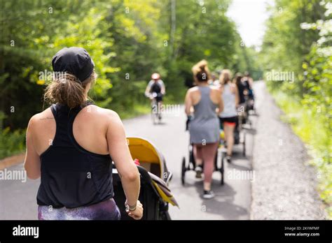 Photo Taken From The Back Of Group Of Mothers Participating In Outdoor