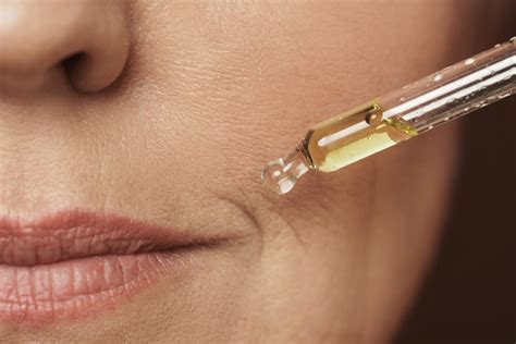 Woman Using Introstem Vitamin C Serum