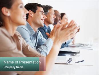 A Group Of People Sitting At A Table Clapping PowerPoint Template Backgrounds Google Slides