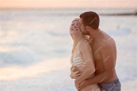 Premium Photo Romantic Couple Kissing On The Beach