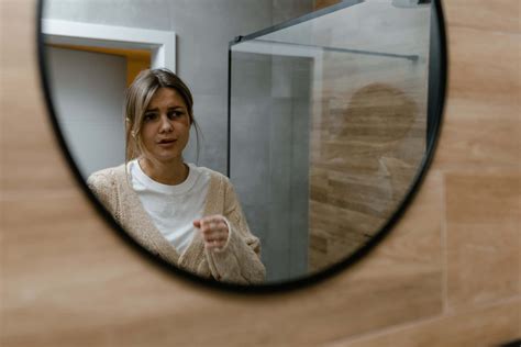 Download Bruised Girl Looking At Reflection Wallpaper