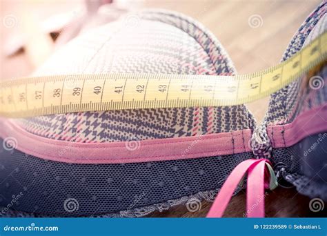 Macro Of A Bra With Measuring Tape On Top On A Table Measure Breast Size Concept Stock Image