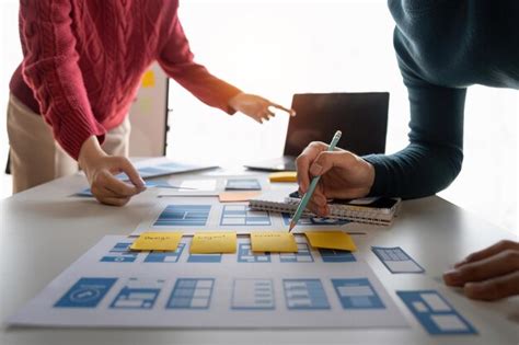 Premium Photo Close Up Ux Developer And Ui Designer Brainstorming