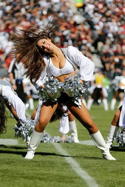 The Cheerleaders Are Performing On The Field